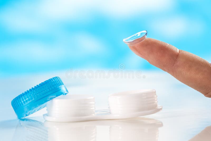 Contact Lens on Finger Tip Blue Background Stock Photo - Image of ...