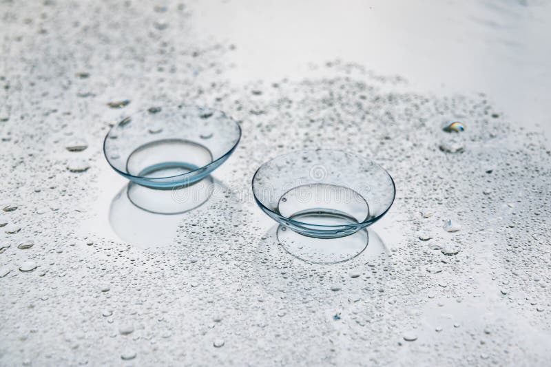 Contact Lenses on Reflective Surface. Stock Image - Image of optics ...