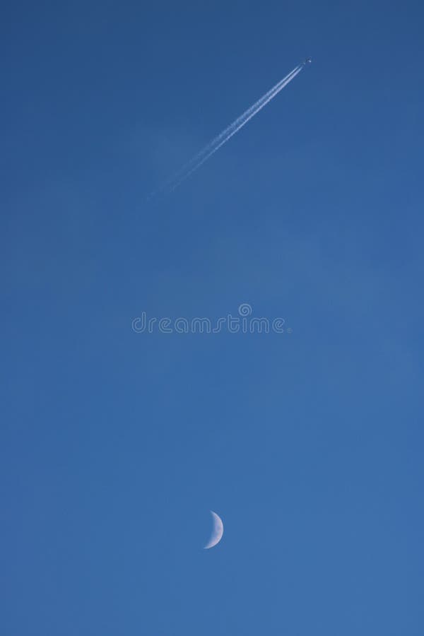 Contrail and Crescent Moon in Clear Blue Sky Stock Image - Image of ...