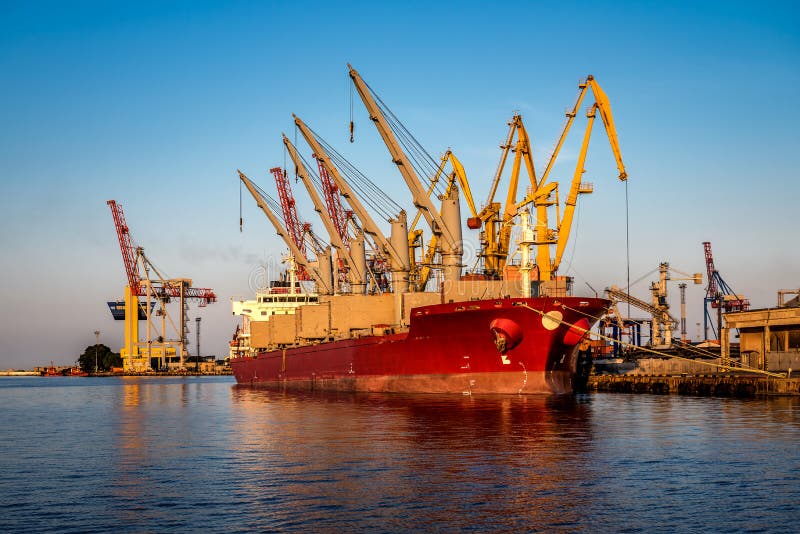 Container Cargo Freight Ship with Working Crane Bridge in Shipyard ...