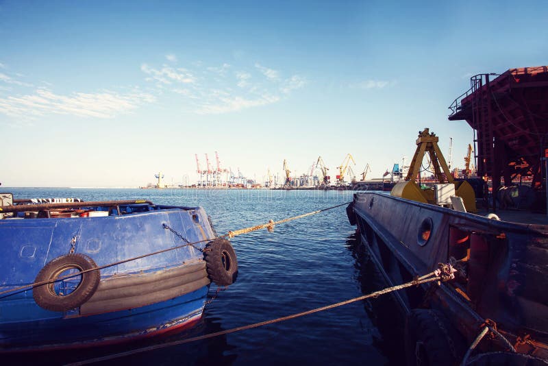 Container Cargo Ship with Working Crane Bridge in Shipyard Background ...