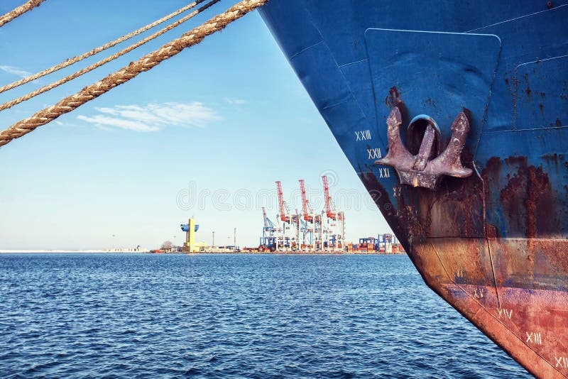 Container Cargo Ship with Working Crane Bridge in Shipyard Background ...