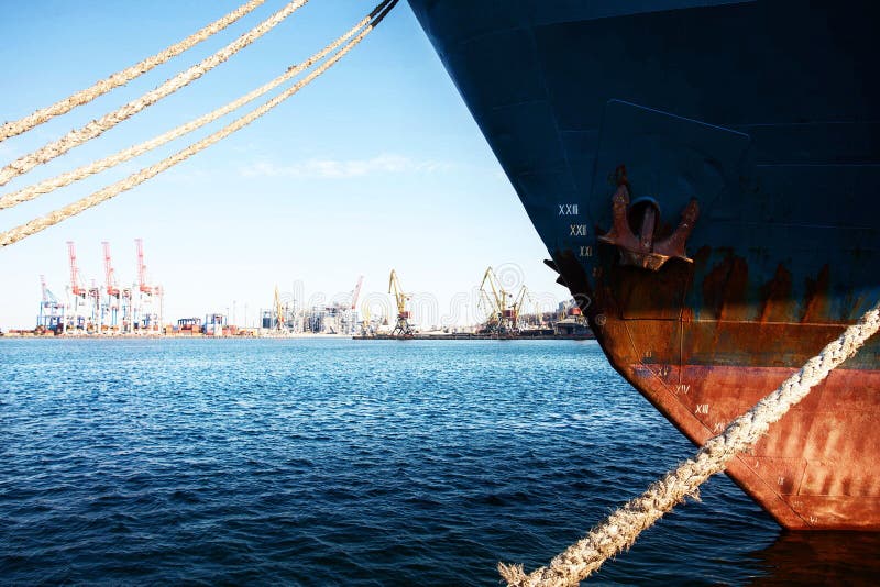 Container Cargo Ship with Working Crane Bridge in Shipyard Background ...