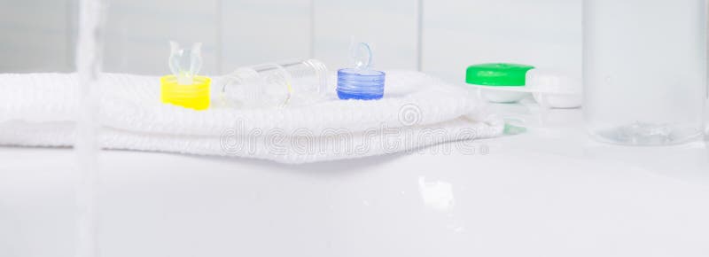 Container for Cleaning Contact Lenses, on a White Towel Stock Photo ...