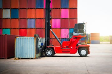 Container Crane Tractor Lifting Up Stacking Cargo Container. Handling ...