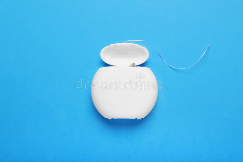 Container with Dental Floss on Light Blue Background, Top View Stock ...