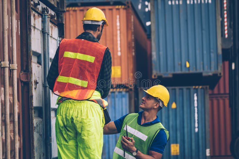 Container Depot Chief Talking with Foreman in Safety Vast and Safety ...