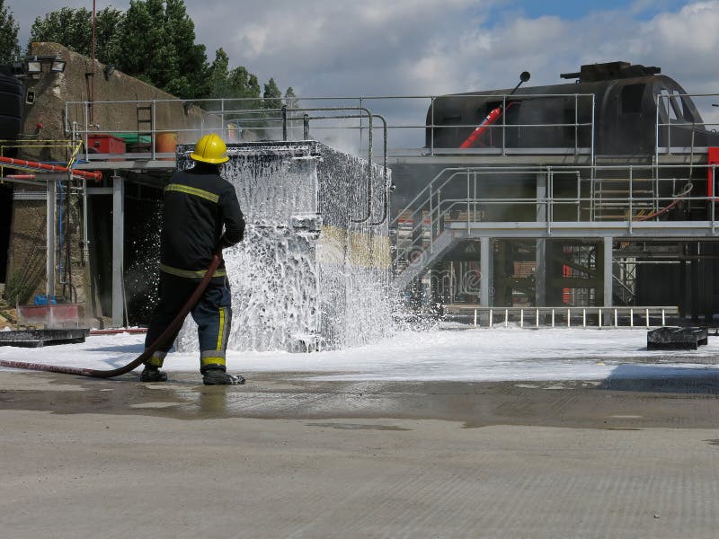 Container Fire Fighting Training. Fire Fighter Spraying Non Aspirated ...