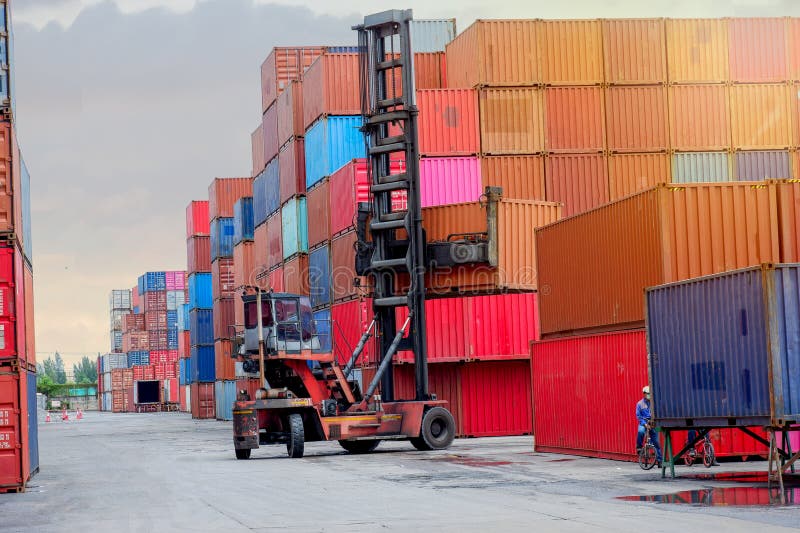 A Container Forklift Sits Behind a Stack of Containers Stock Image ...
