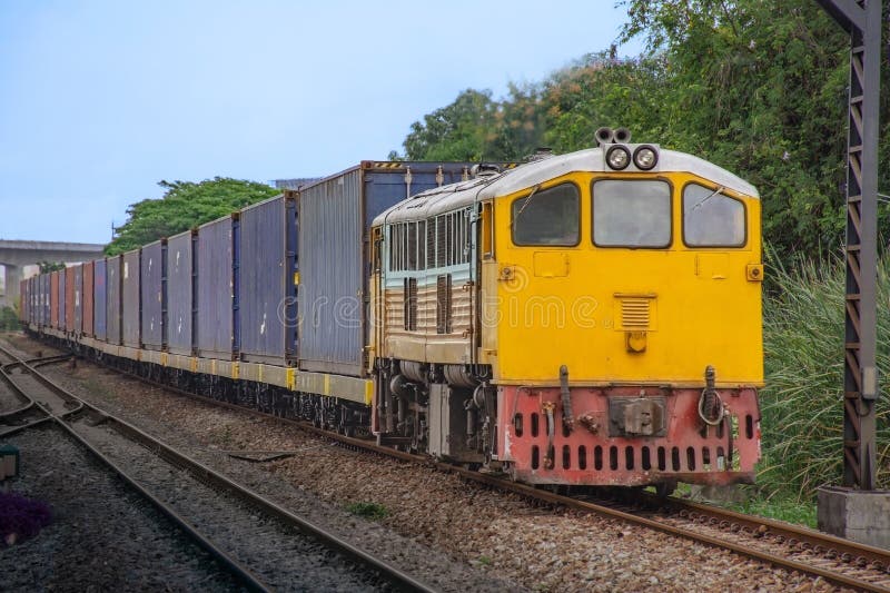 Container-freight Train by Diesel Locomotive on the Railway. Stock ...