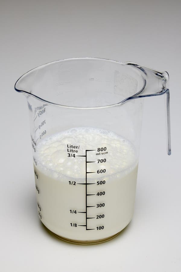 A Container with Graduated Milk Stock Photo - Image of liquid, lactose ...