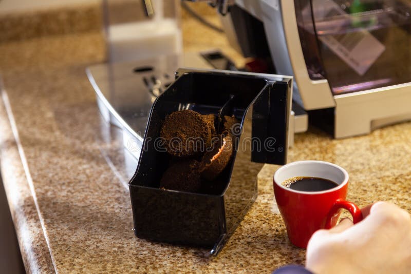 Container for Grounds after Coffee Machine and Cup of Coffee Stock ...