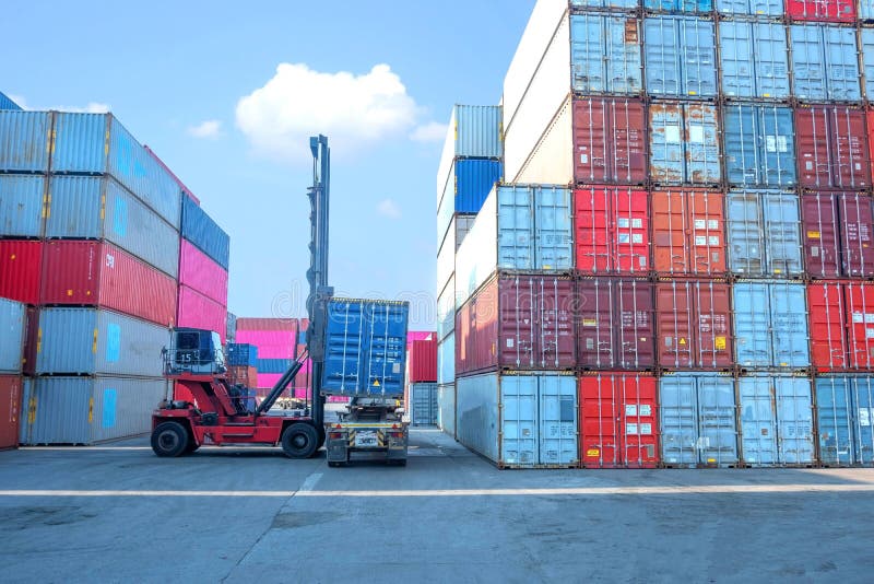Container Handlers in the Shipping Dock with Storage Cabinet Background ...