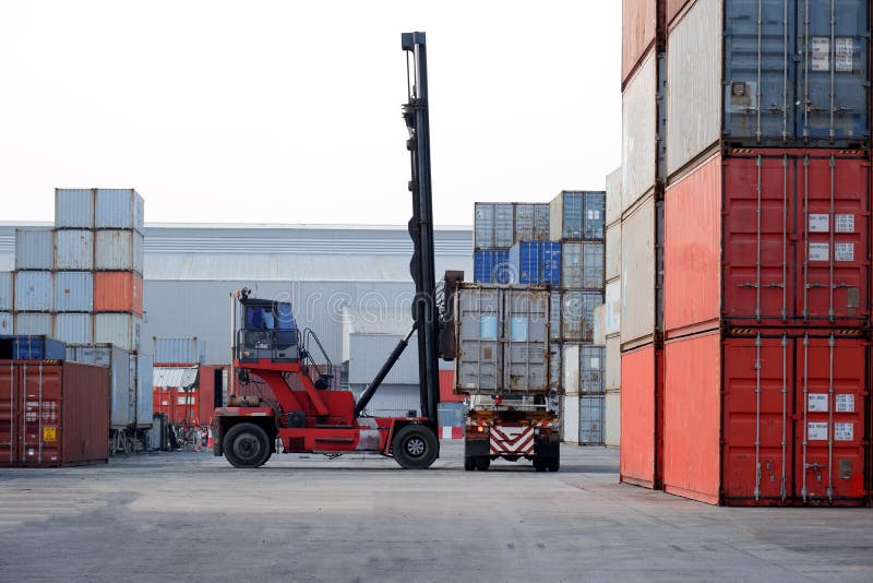 Container Handlers and Trucks Work Simultaneously. in the ...
