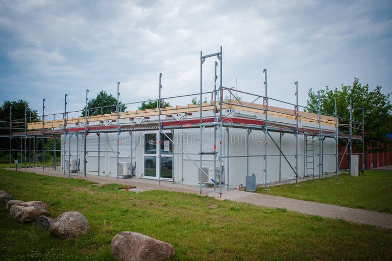 A Container House is Scaffolded with Scaffolding Stock Photo - Image of ...