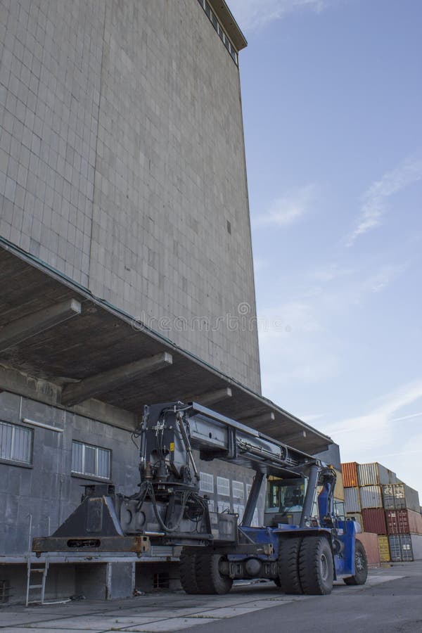 Container lifter stock image. Image of garage, gate, containers - 46087323