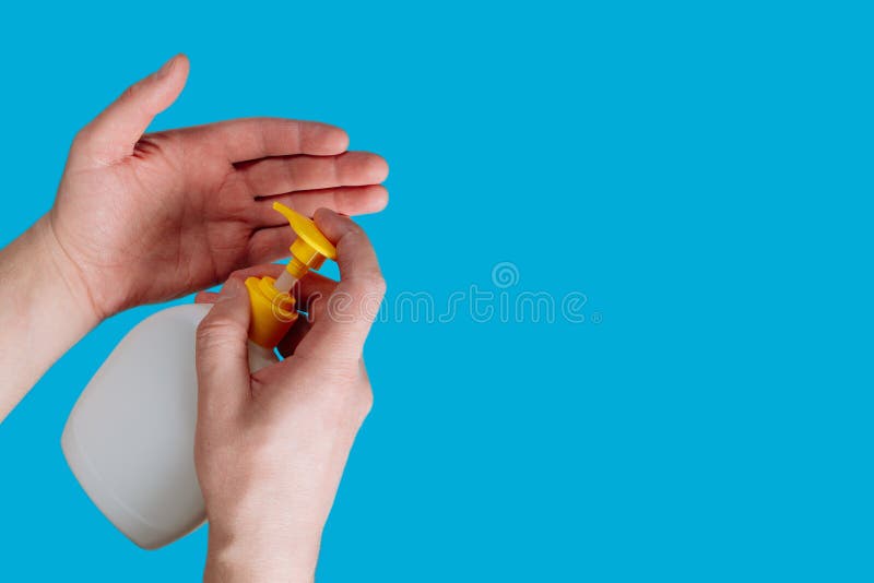 Container with Liquid Soap and Hands on a Blue Background. Disinfection ...