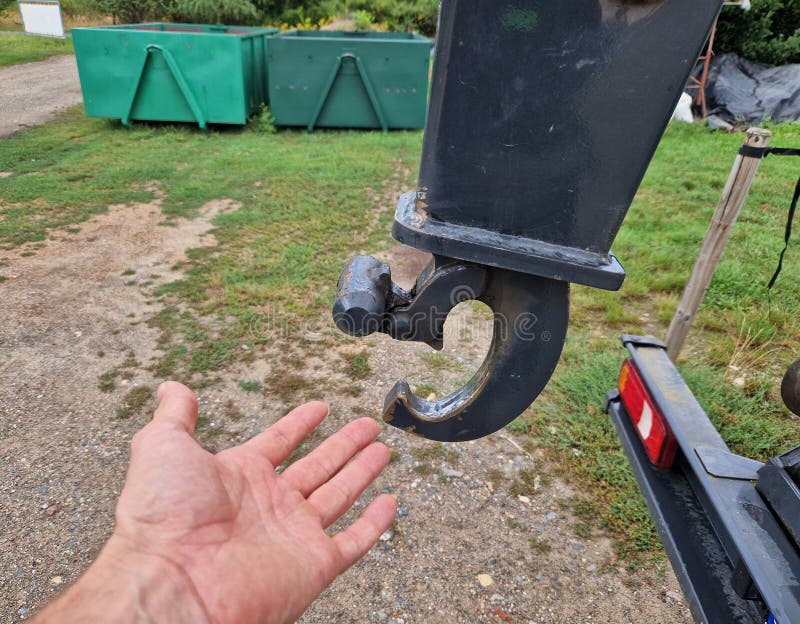 Container is Loaded with a Lever with Hook for an Eye-shaped Handle ...