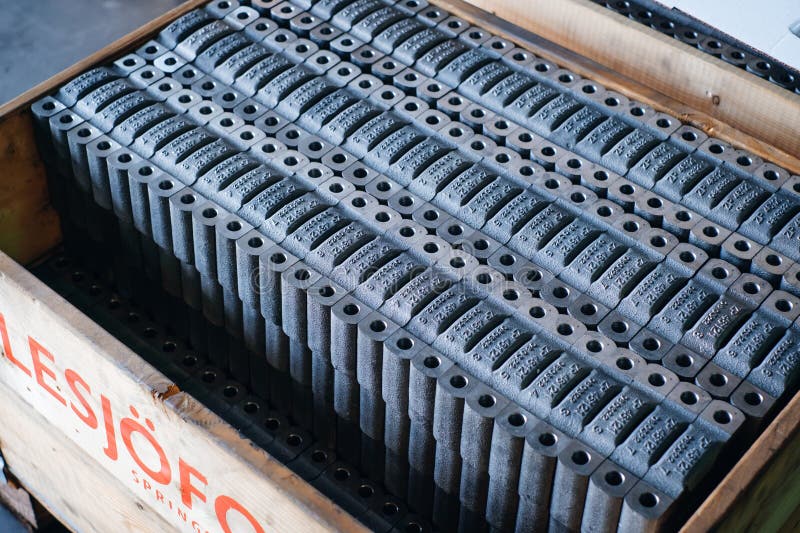 Rows of Engineered Metal Components Carefully Arranged in a Wooden ...