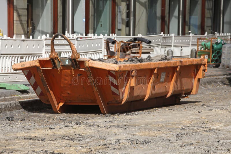 Container, Orange Skip for Construction Waste Standing on the Road ...