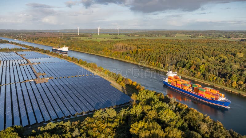 Container Ship and Car Ferry Navigate the Kiel Canal Alongside Vast ...