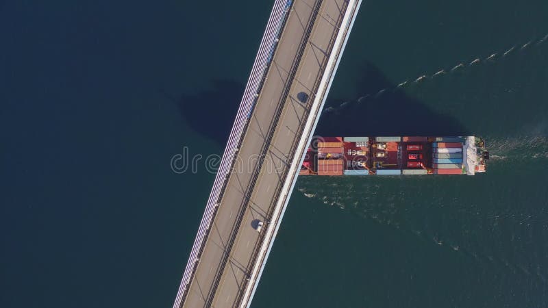 Container Ship with Cargo of Containers Passes Under the Bridge Stock ...