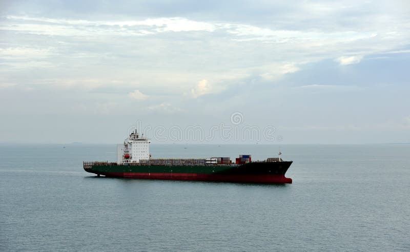 Large Cargo Container Ship Sailing through Calm Sea. Stock Photo ...