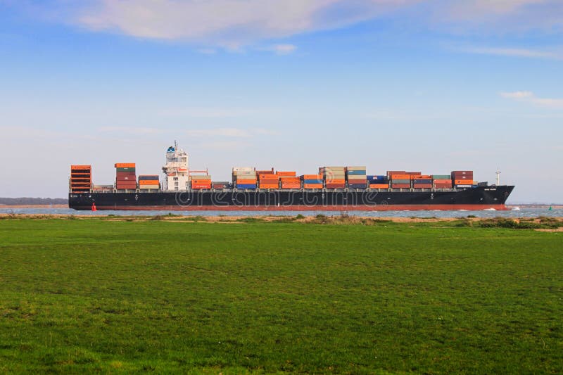 Container ship with cargo editorial stock photo. Image of long - 64867833