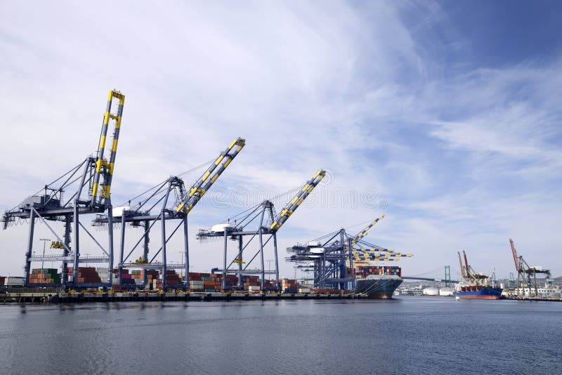 Container Ship Docked in Port Unloading Cargo. Stock Image - Image of ...