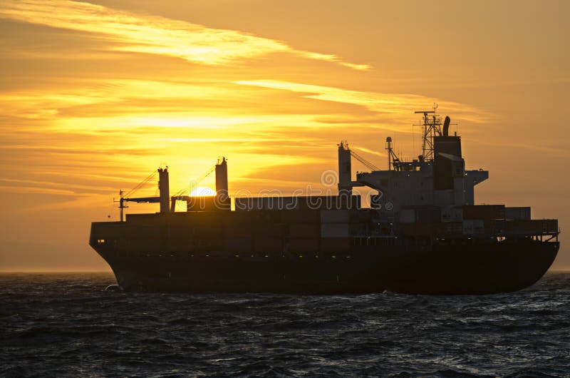 Container Ship in Front of Sunset Stock Image - Image of orange ...