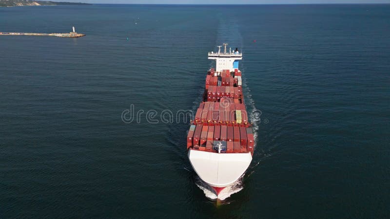 A Container Ship at Full Speed is Approaching the Seaport, Aerial View ...