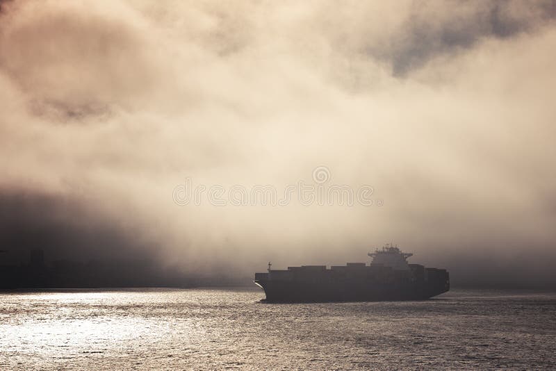 Container ship inside mist stock photo. Image of island - 38977048