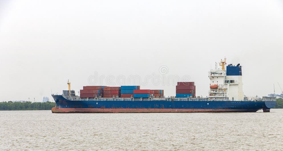 The Container Ship Loaded of Containers Sail beside a Seashore Stock Image - Image of boat ...