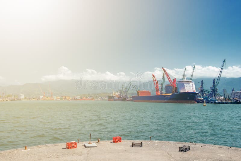 Container Ship Loading in Trade Port with Boxes on Pier on Foreground ...