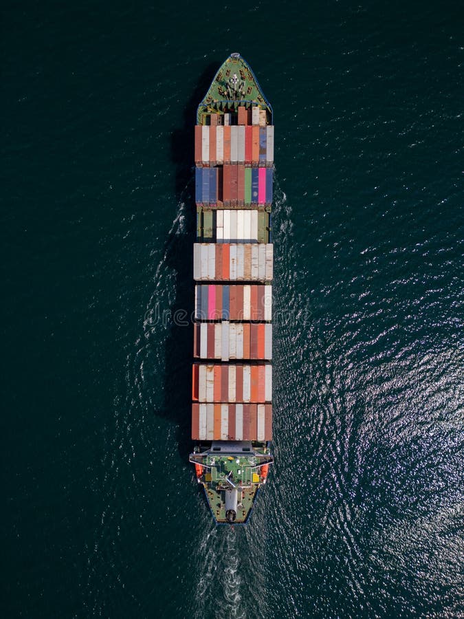 A Container Ship Moves Steadily through the Ocean, Carrying Stacked ...
