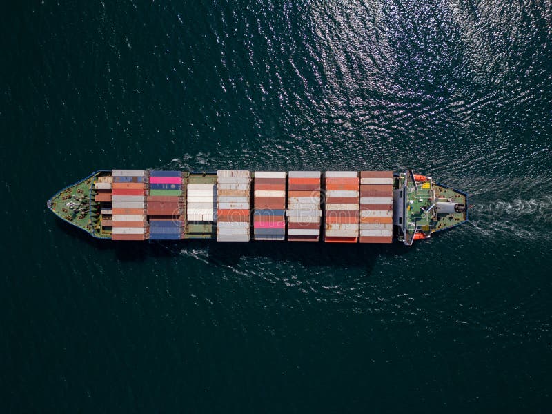 A Container Ship Moves Steadily through the Ocean, Carrying Stacked ...