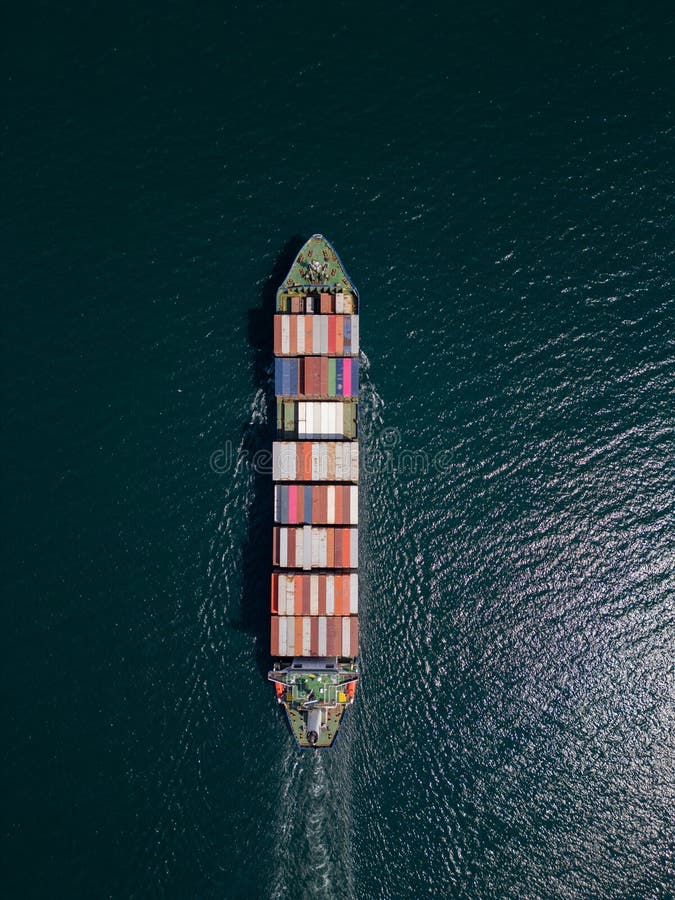 A Container Ship Moves Steadily through the Ocean, Carrying Stacked ...