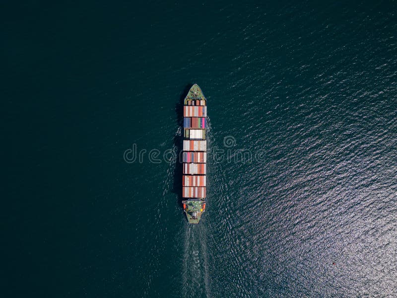 A Container Ship Moves Steadily through the Ocean, Carrying Stacked ...