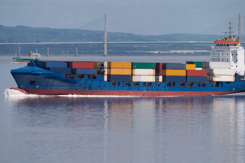 A Container Ship Passes a Bridge Stock Image - Image of boat, shipping ...