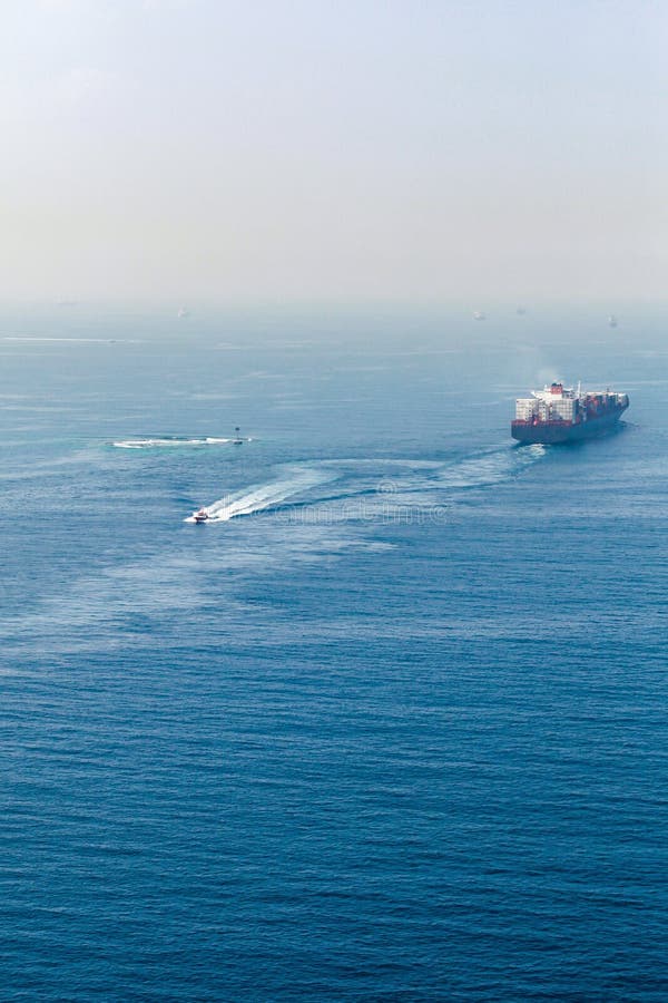 Container Ship and a Pilot Boat Sail the Red Sea Stock Photo - Image of ...