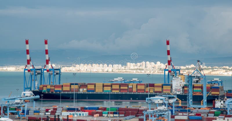 Container Ship at the Port.Against the Backdrop of a Sun-drenched City ...