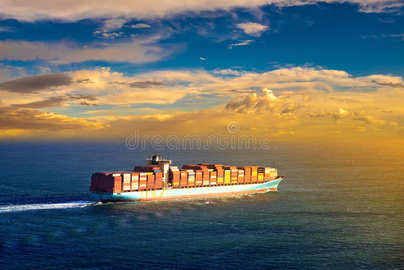 Container ship at sunset stock image. Image of heavy - 254803699