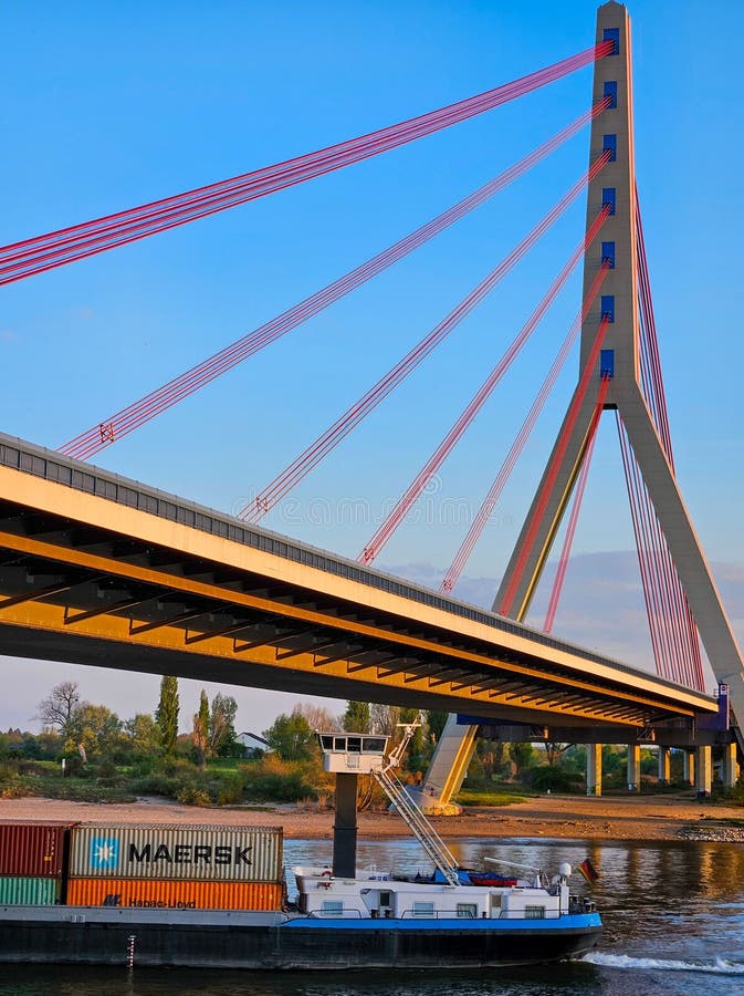 Container Ship Under a Modern Bridge at Sunset Editorial Image - Image ...