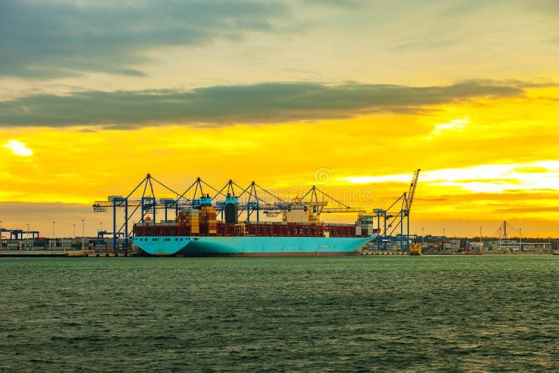 Container Ship Unloading at a Dock Stock Image - Image of loading, port ...