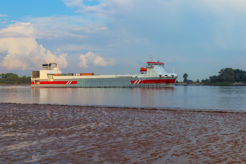 Container Ship on a River at Low Tide with Blue Sky Stock Image - Image ...