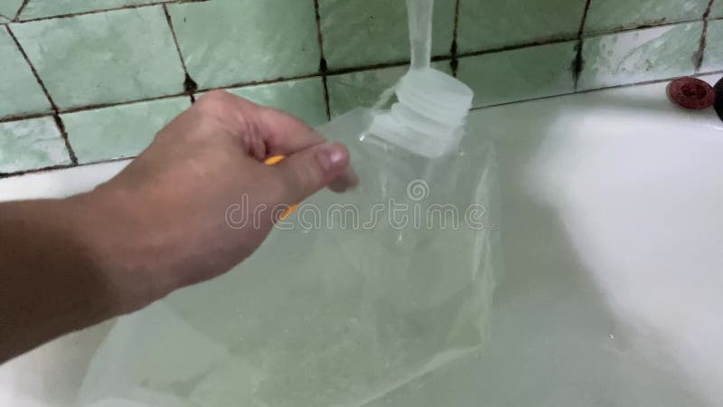 A Container for Storing and Transporting Water is Filled Stock Video ...