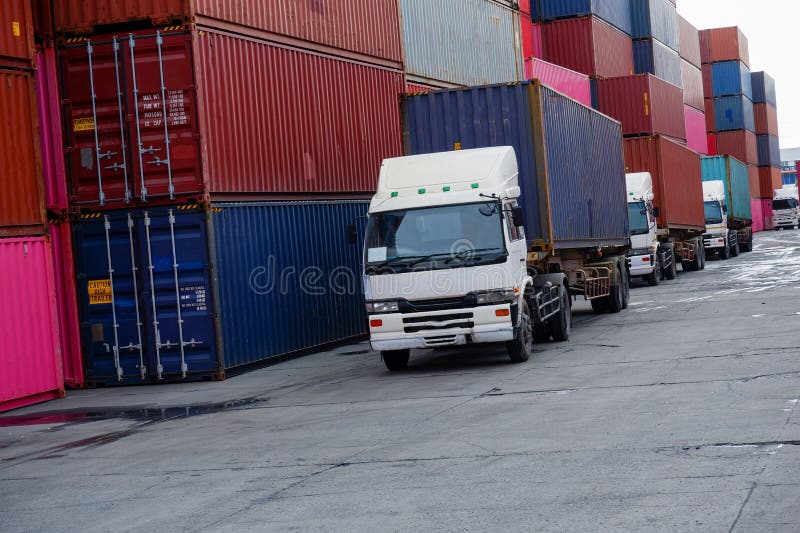A Container Truck Sits Behind a Pile of Containers Stock Photo - Image ...