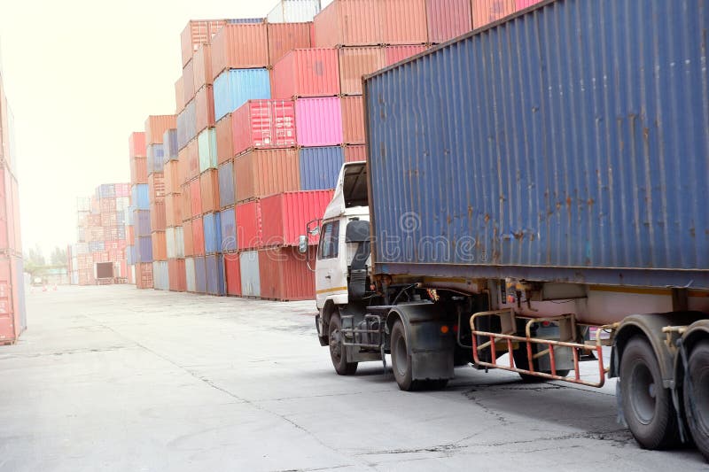 A Container Truck Sits Behind a Pile of Containers Stock Photo - Image ...