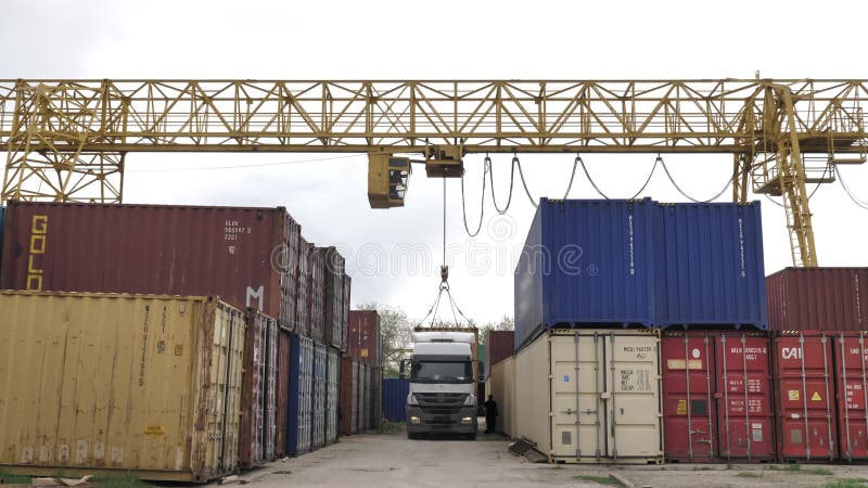 Container Vessel during Loading at an Industrial Storage by Crane Stock ...