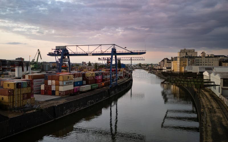 The Water that Has Containers Stacked on it is Being Lifted by the ...